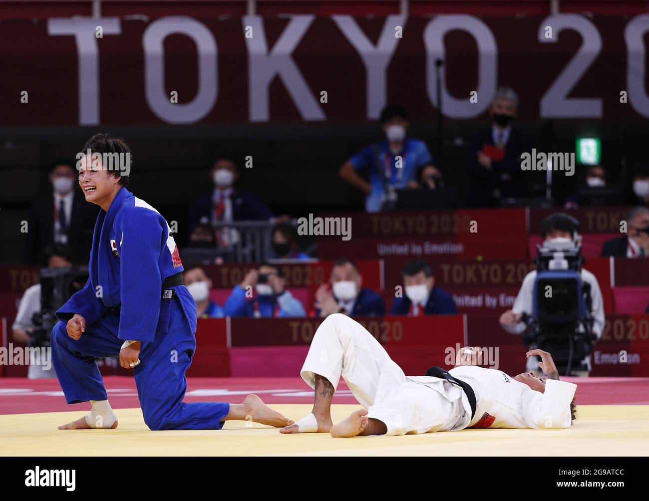 Tokyo, Japan. 25th July, 2021. Uta Abe from Japan (blue) celebrates ...
