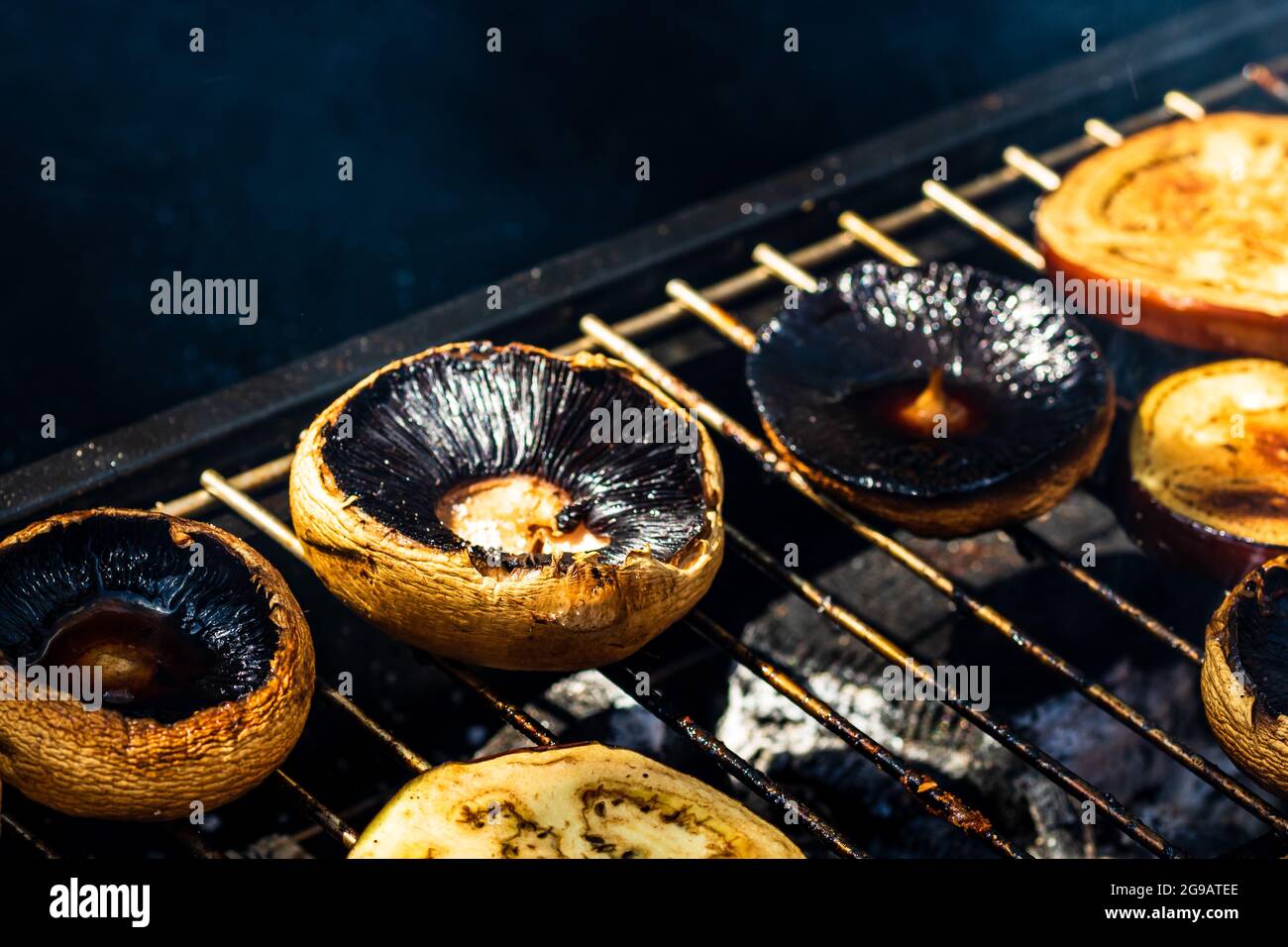 A high angle shot of champignon mushrooms and veggies being cooked on ...