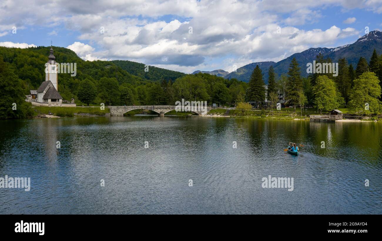 Aerial bird eye shot of a canoe with two person paddling, on beautiful ...