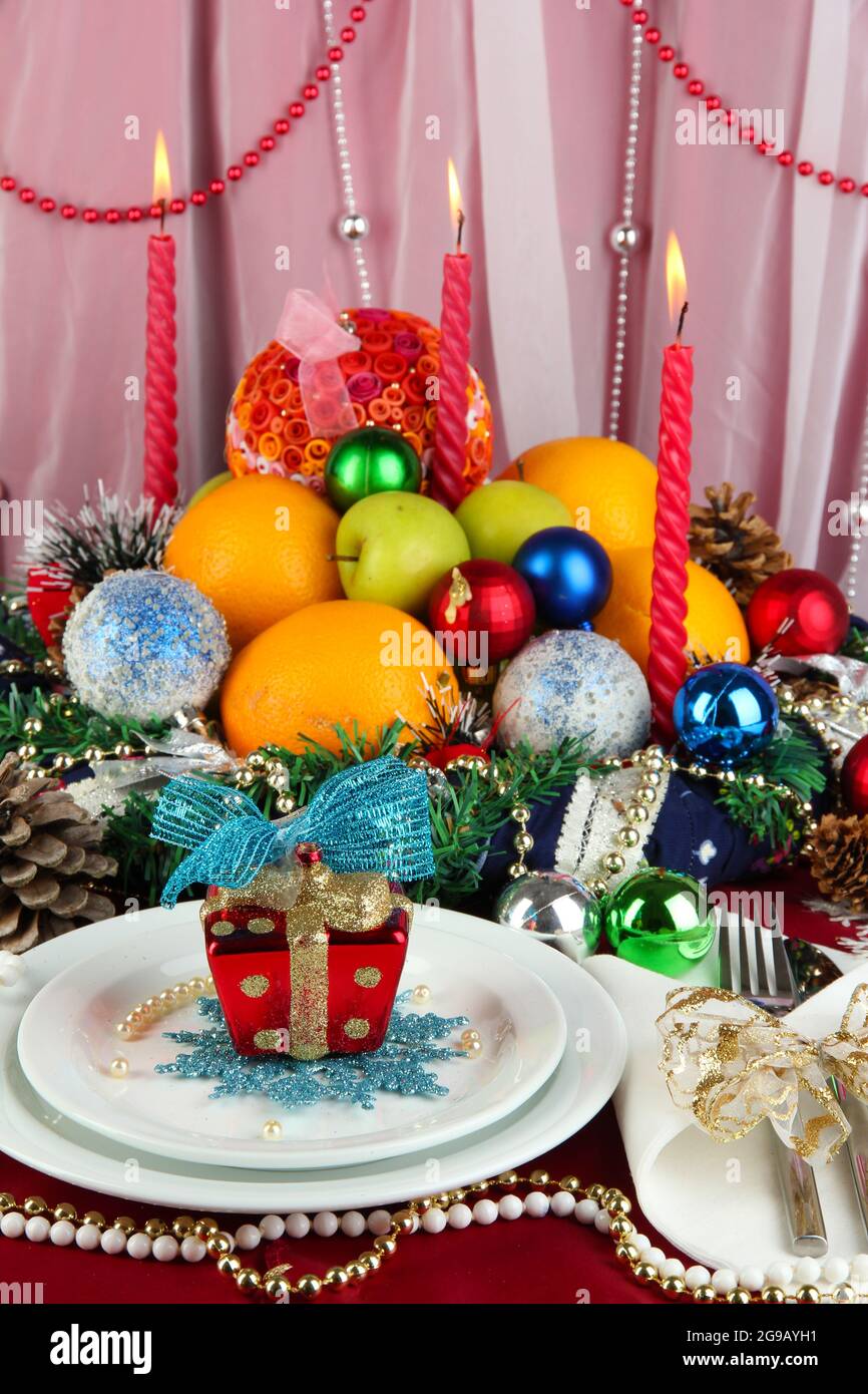 Serving Christmas table on white fabric background Stock Photo - Alamy