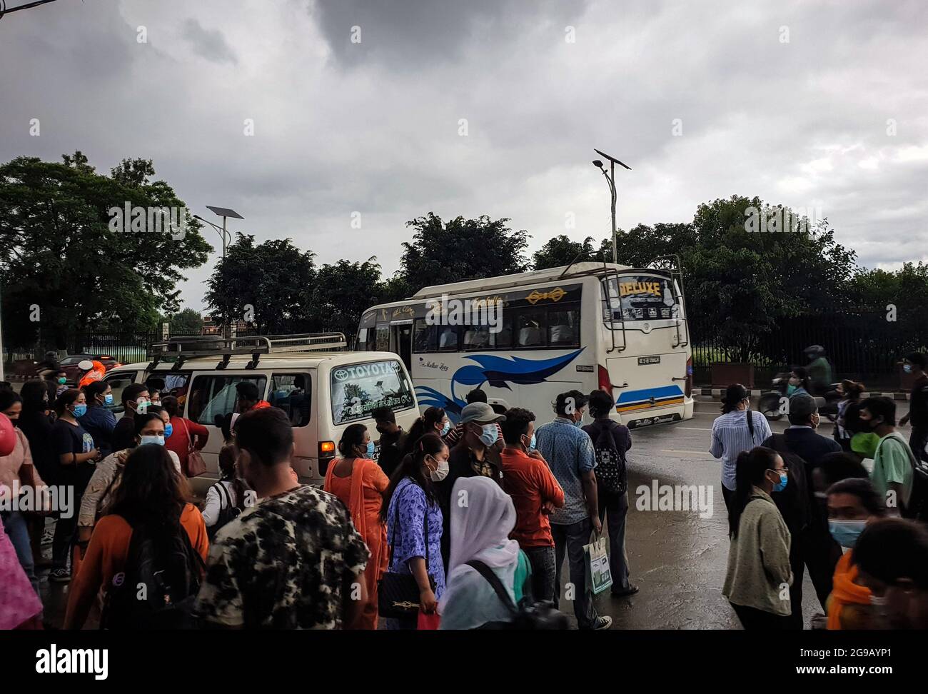 Kathmandu, Bagmati, Nepal. 25th July, 2021. Nepali people gather at bus ...