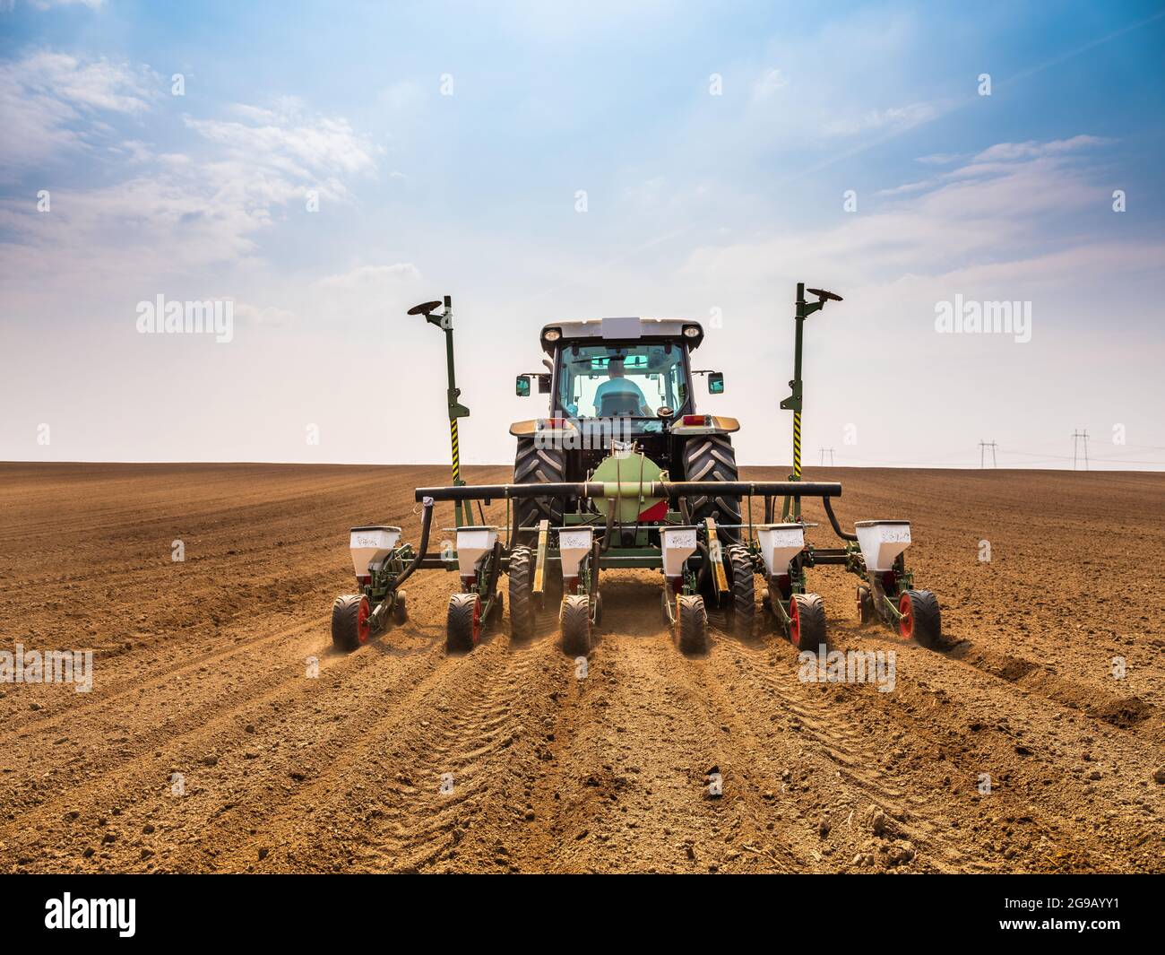 Farmer seeding, sowing crops at field. Sowing is the process of ...