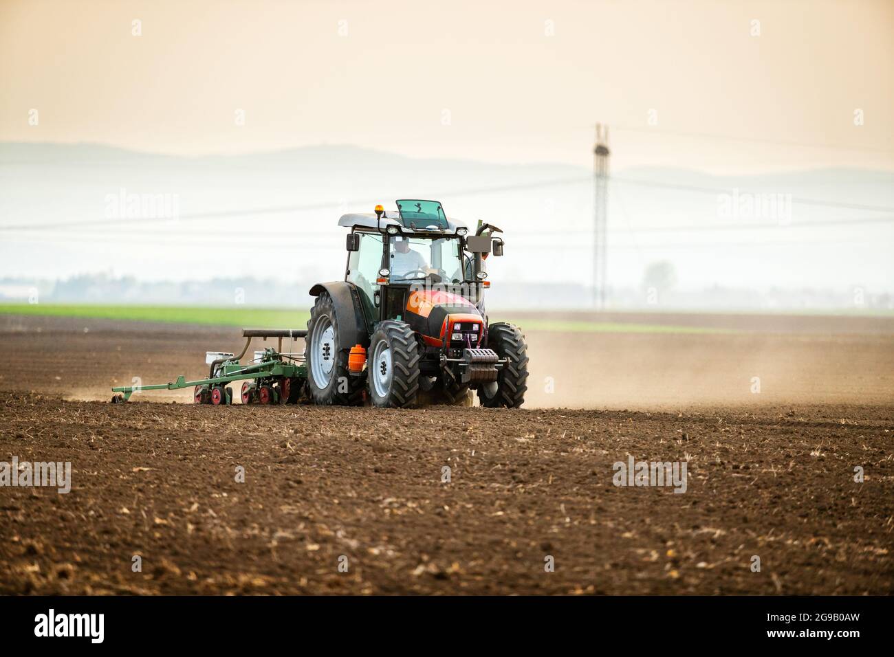 Farmer seeding, sowing crops at field. Sowing is the process of ...