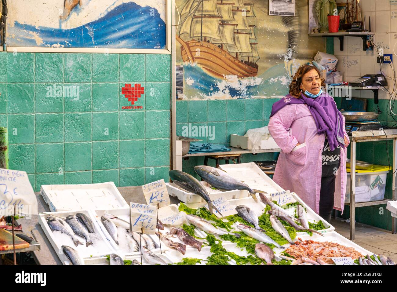 Naples, Italy, May 2021 – Female fishmonger working in a stall of ...