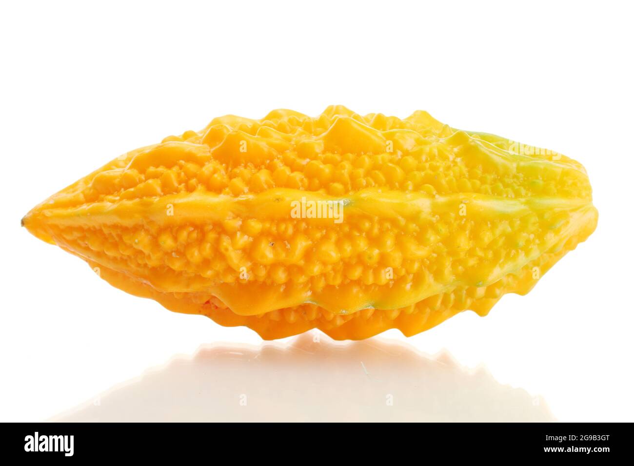 ripe momordica fruit, isolated on white Stock Photo - Alamy