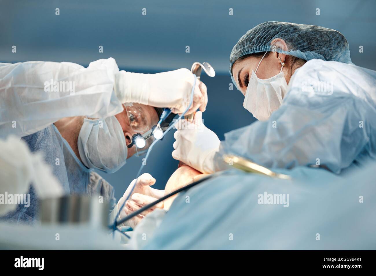 Close up of doctors and nurses in operating room, professional doctors ...