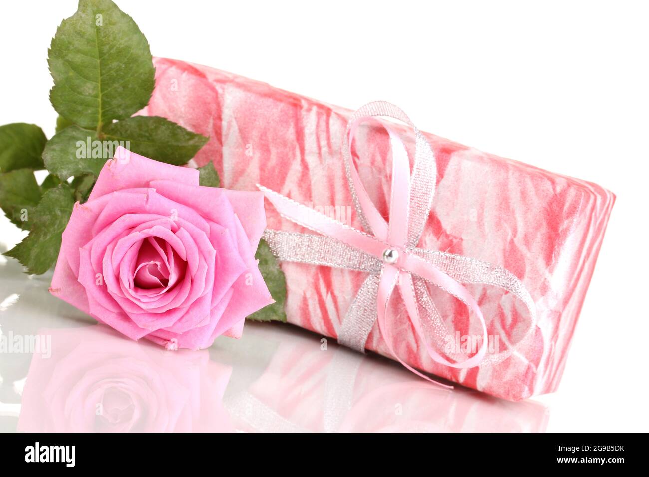 Beautiful pink rose with wonderful gift in pink box isolated on white ...