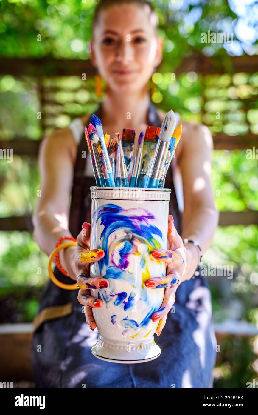 Real female artist dirty paint hi-res stock photography and images - Alamy