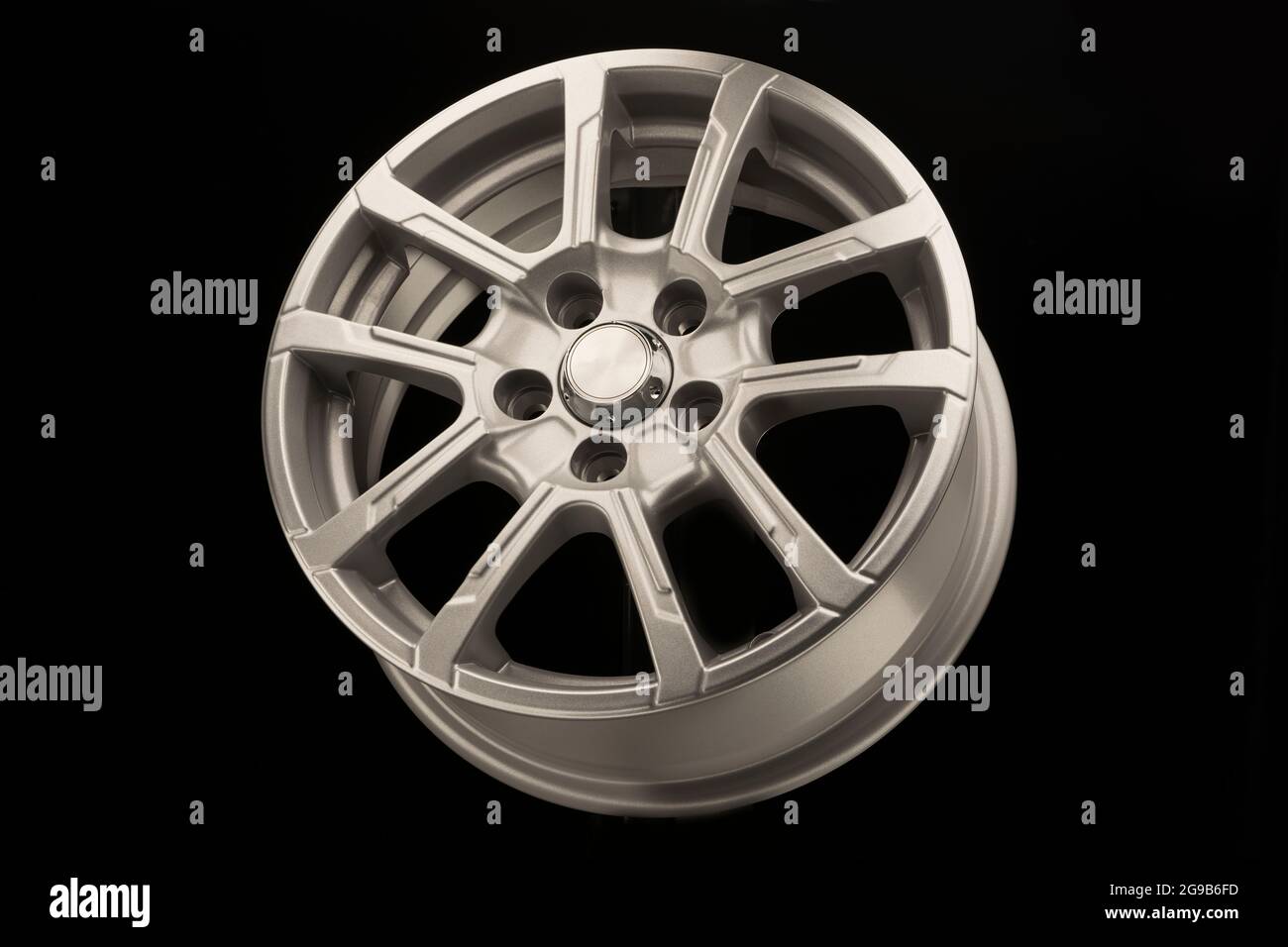 grey new alloy wheel for car, side view on black background Stock Photo ...