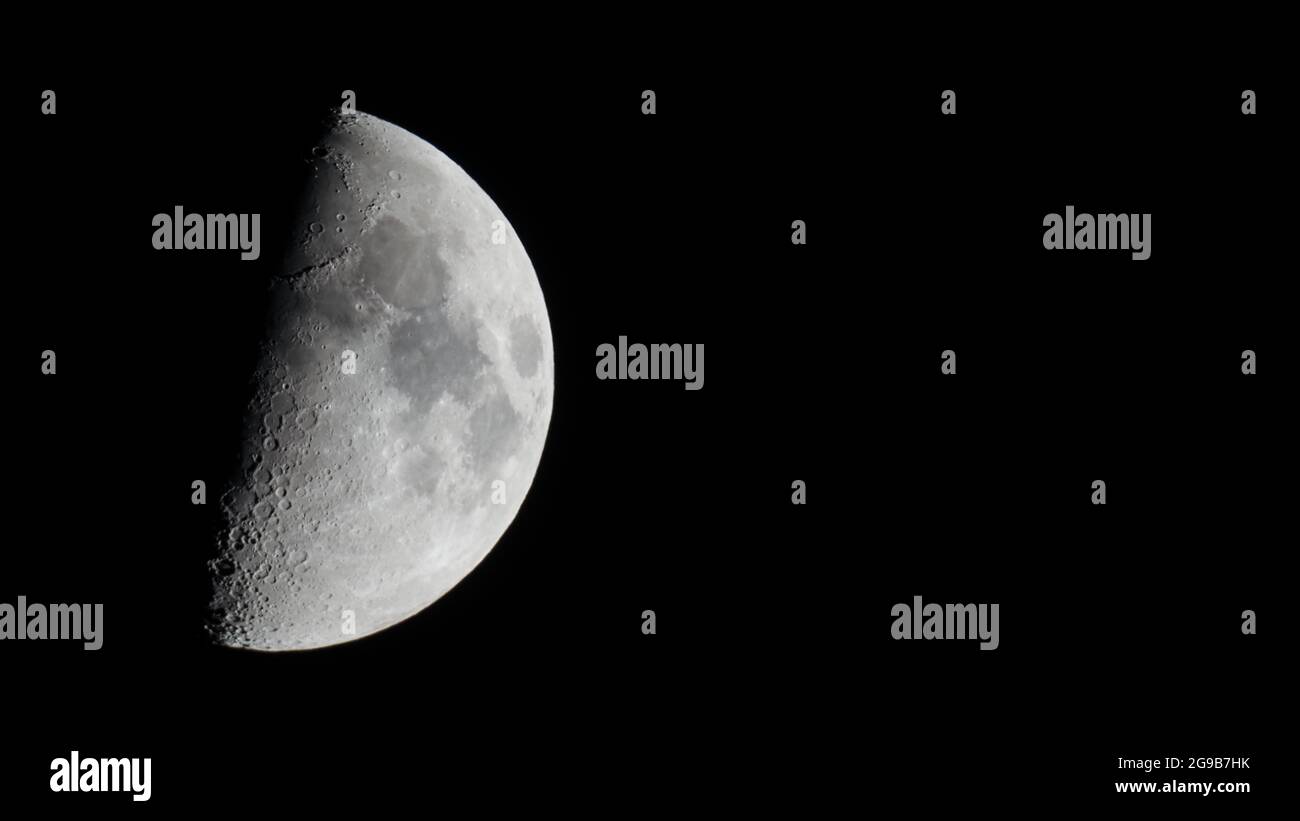 Half moon first quarter seen with astronomical telescope Stock Photo ...