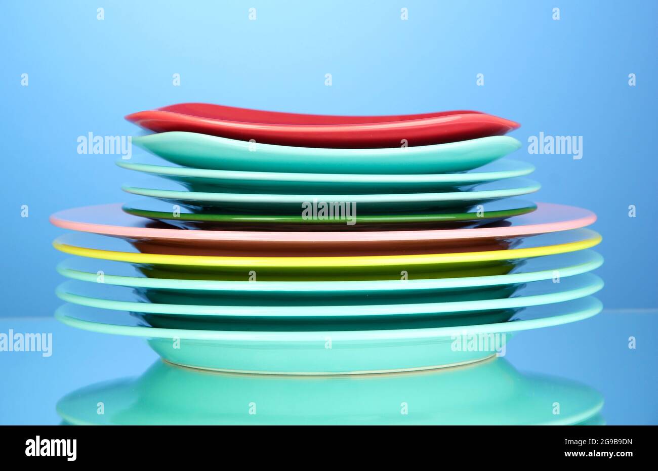 Color plates on blue background Stock Photo - Alamy