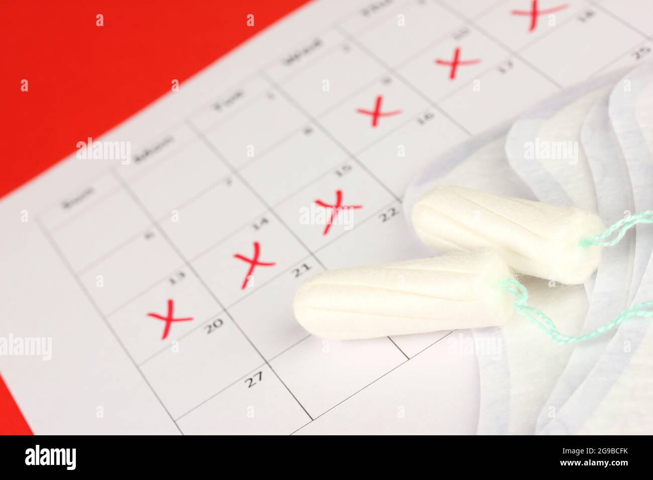 menstruation calendar with sanitary pads and tampons, close-up Stock ...