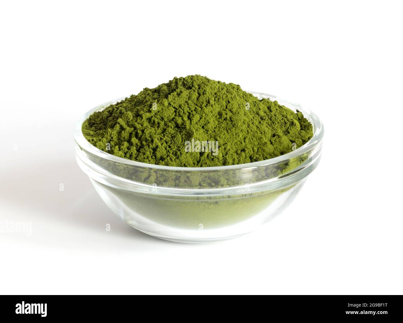 Chlorella powder in a bowl isolated on a white background. Green ...