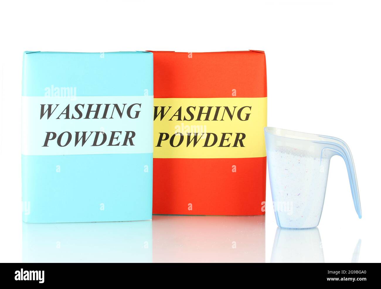 Boxes of washing powder with blue measuring cup isolated on white Stock ...