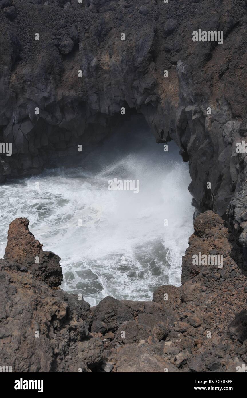 A closeup of fast-moving water splashing over the rocks Stock Photo - Alamy