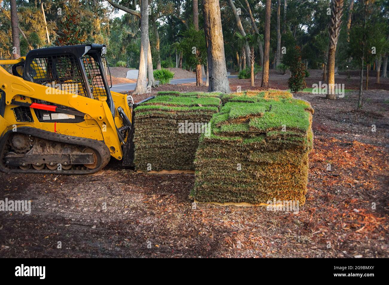 small portable yellow construction bulldozer with forklift attachment ...