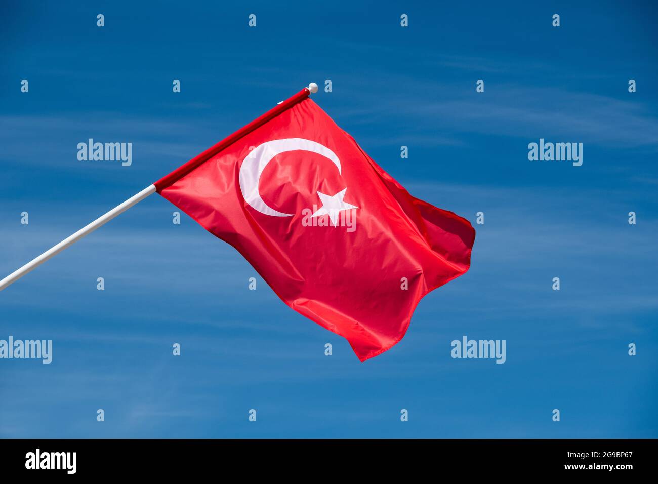 Flag of Turkey on blue sky background Stock Photo - Alamy