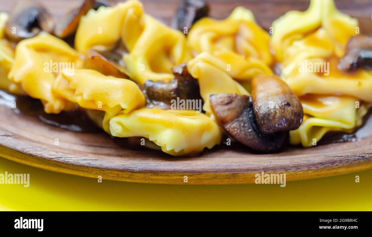 Fresh egg pasta with ricotta cheese and porcini mushrooms paste filling ...