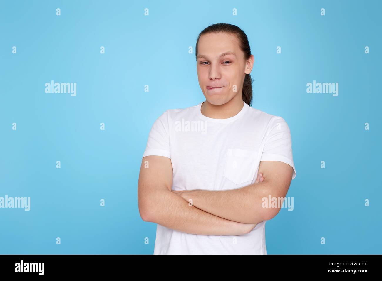 young handsome man with a doubt on his face Stock Photo - Alamy