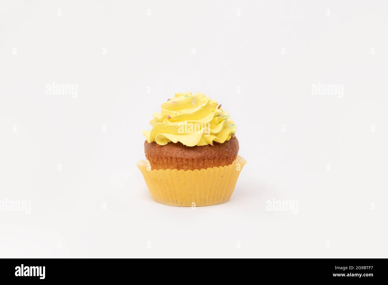yellow and green Cupcake on white background Stock Photo - Alamy