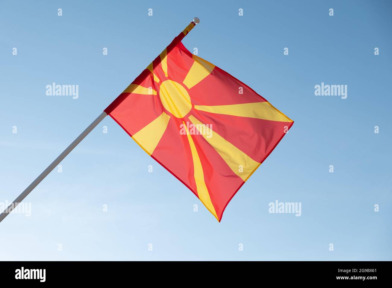 Flag of North Macedonia on blue sky background Stock Photo - Alamy