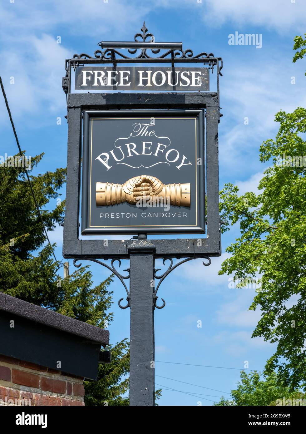 Traditional hanging pub sign at The Purefoy public house, Preston ...