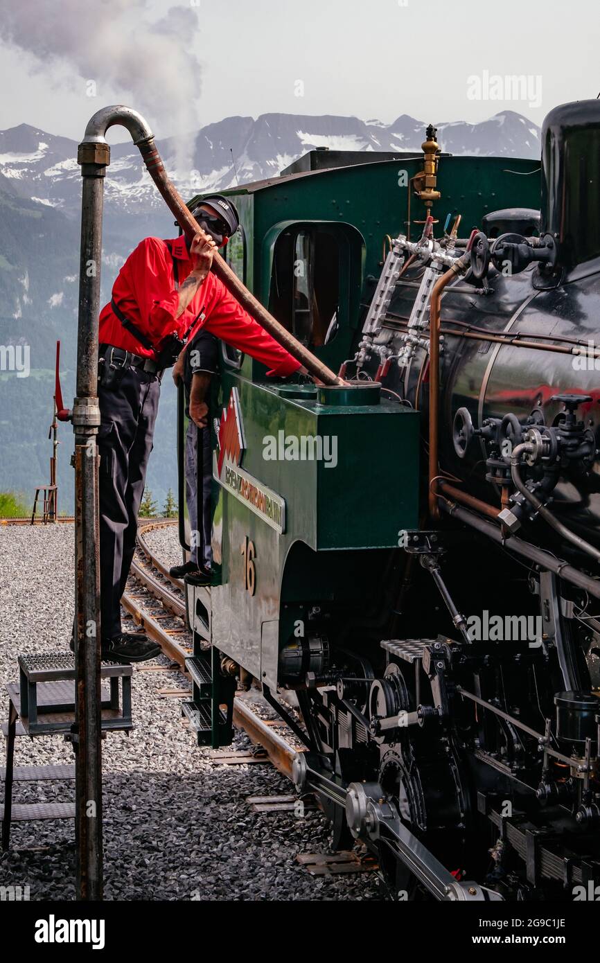 A Worker Refilling with Water - Train from Rothorn to Brienz - Brienz ...