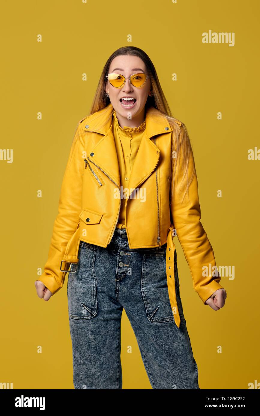happy woman screaming on yellow background. Human emotions Stock Photo ...