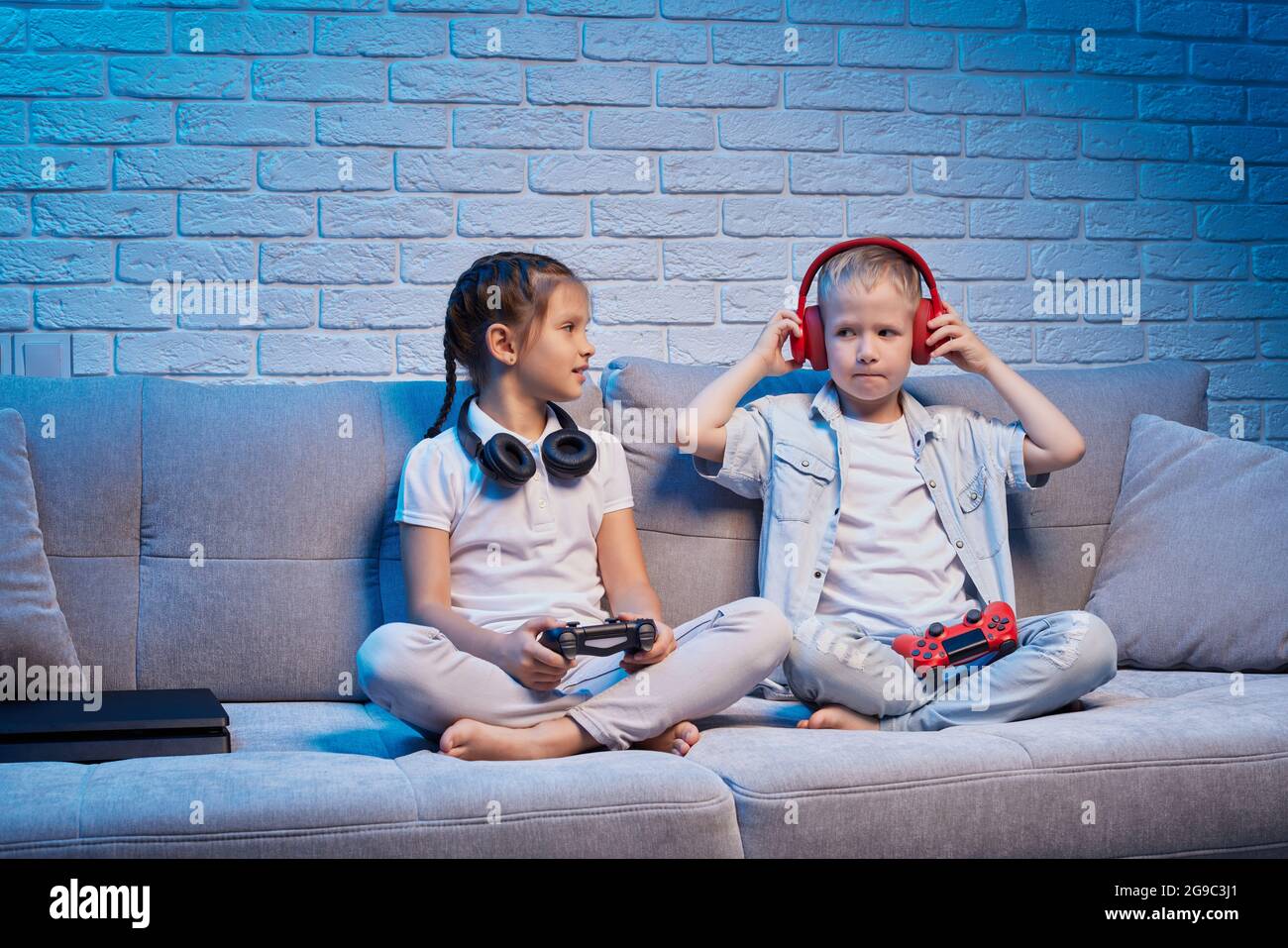 children playing video game with game console Stock Photo - Alamy