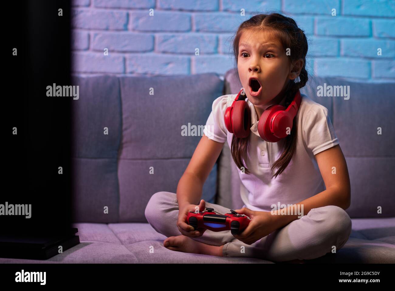 children playing video game with game console Stock Photo - Alamy