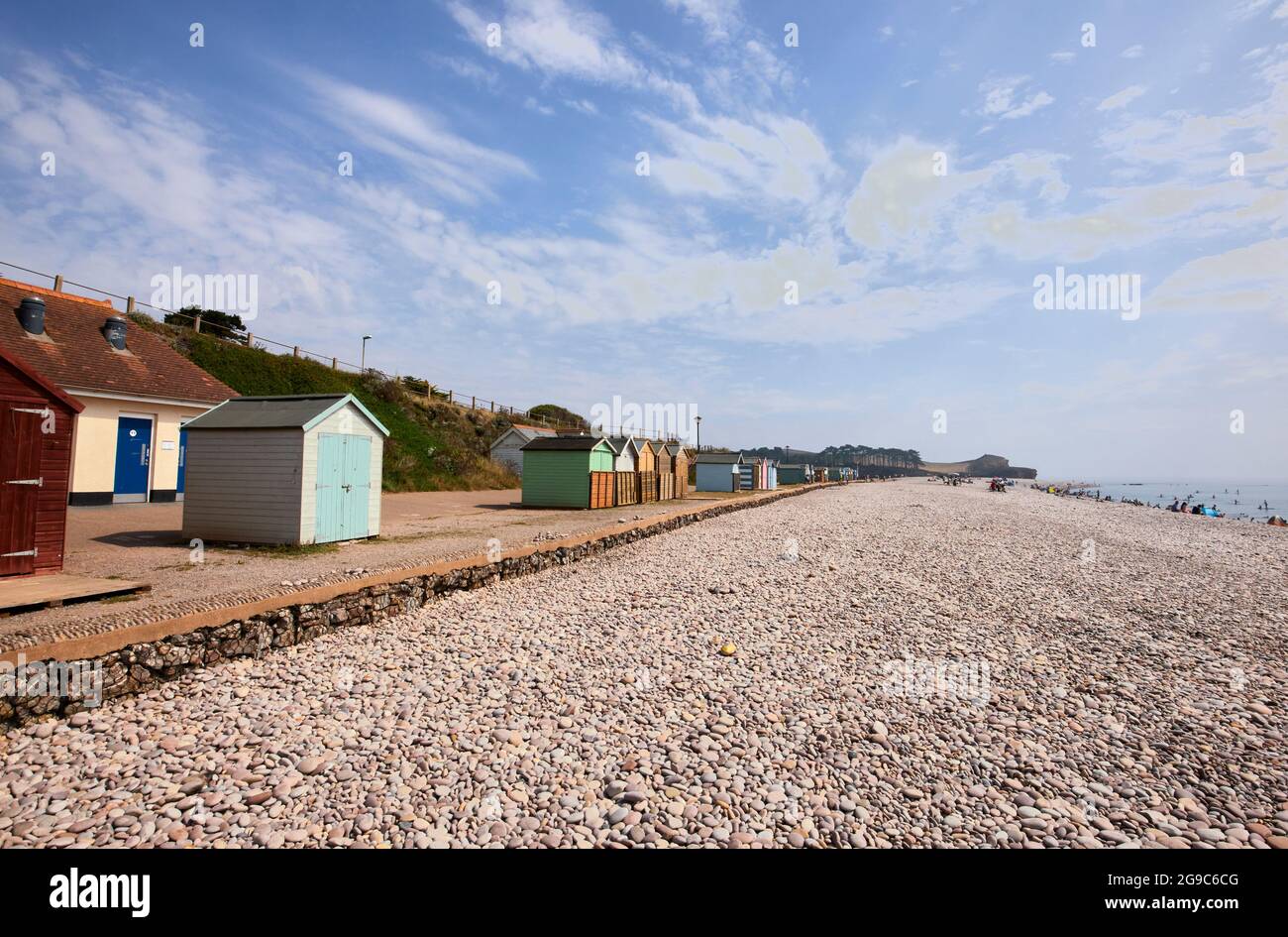 Closed seafront beach huts on the promenade at Budleigh Salterton, a ...
