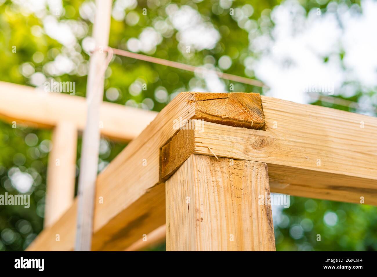 Corner connection of a wooden structure close-up Stock Photo - Alamy