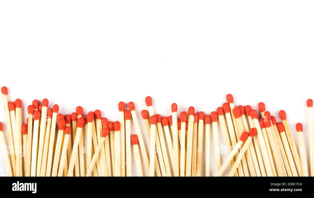 A top view closeup of matches scattered around a white background Stock ...
