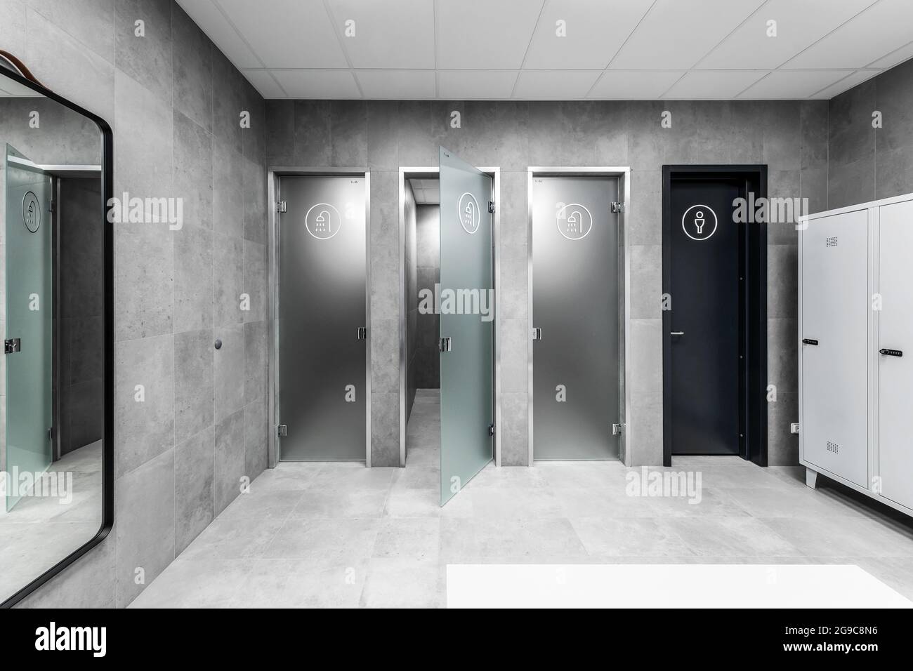 Modern minimalist interior of public shower room with grey clay wall ...
