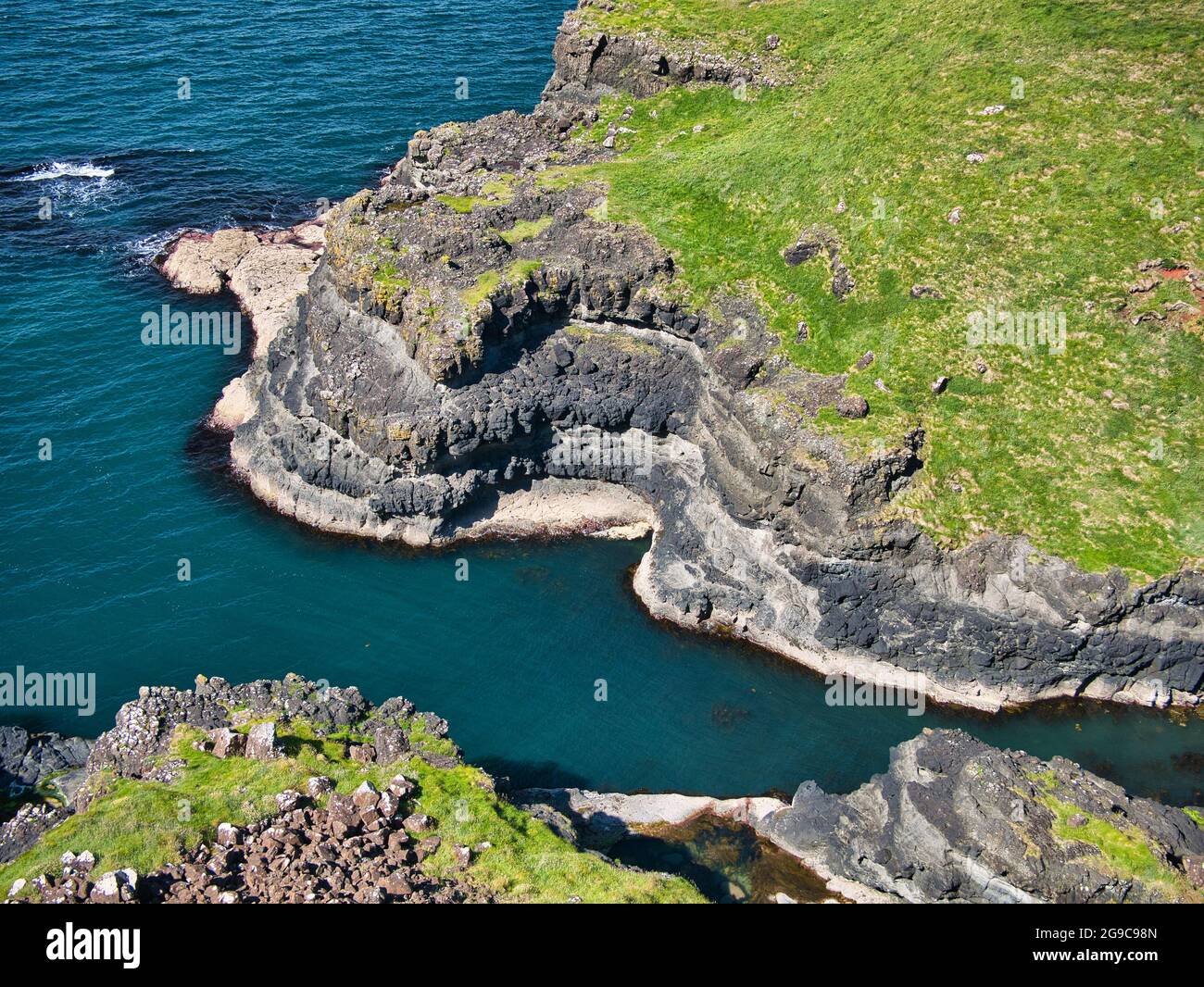 Coastal cliffs showing exposed strata near Portrush on the Antrim ...