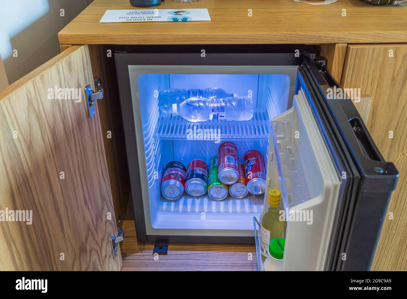Close up view of open minibar at hotel room Stock Photo - Alamy
