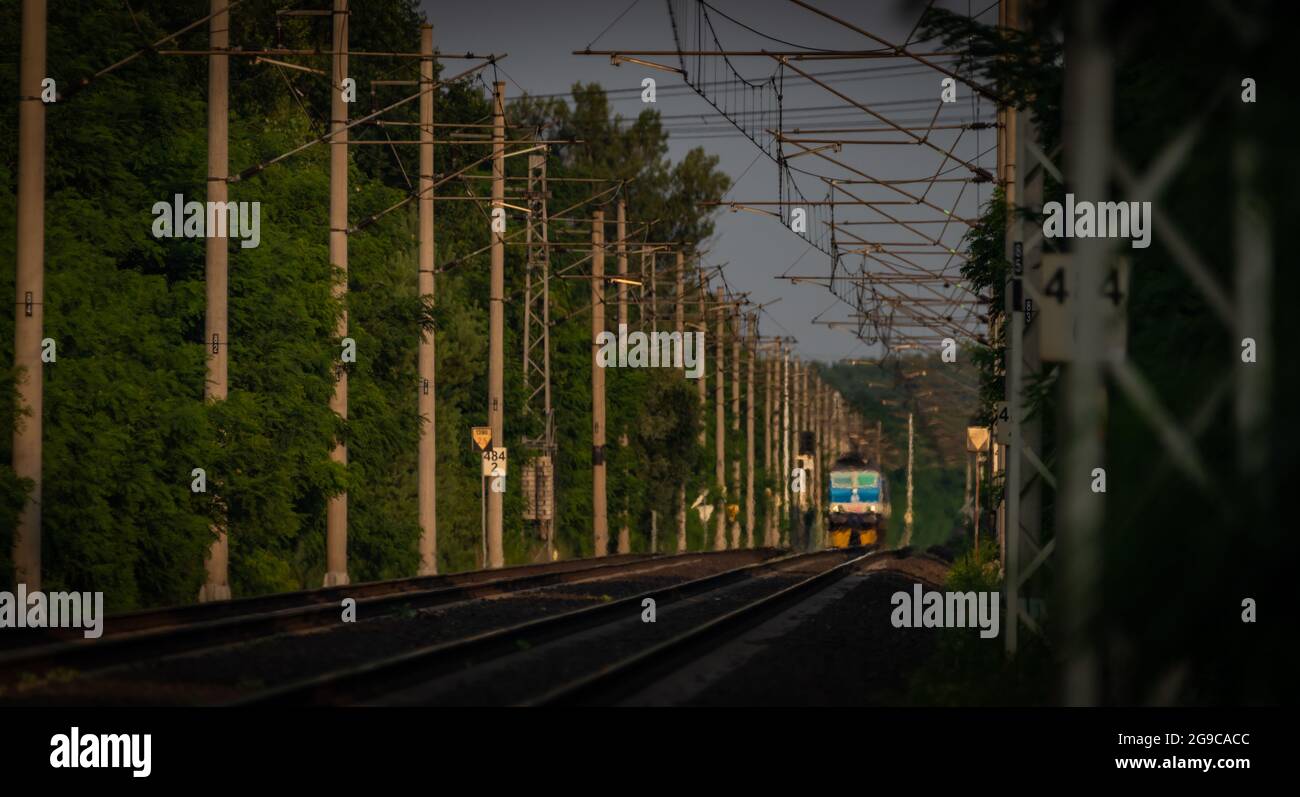 Trains and small whistle stop Olesko in central Bohemia in sunset orange evening Stock Photo - Alamy