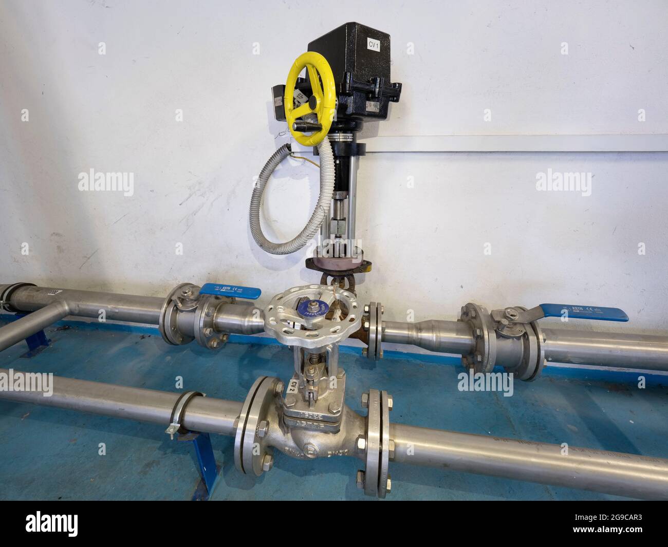 Stainless stopcock valve on stainless gas pipeline branch. Cables to ...