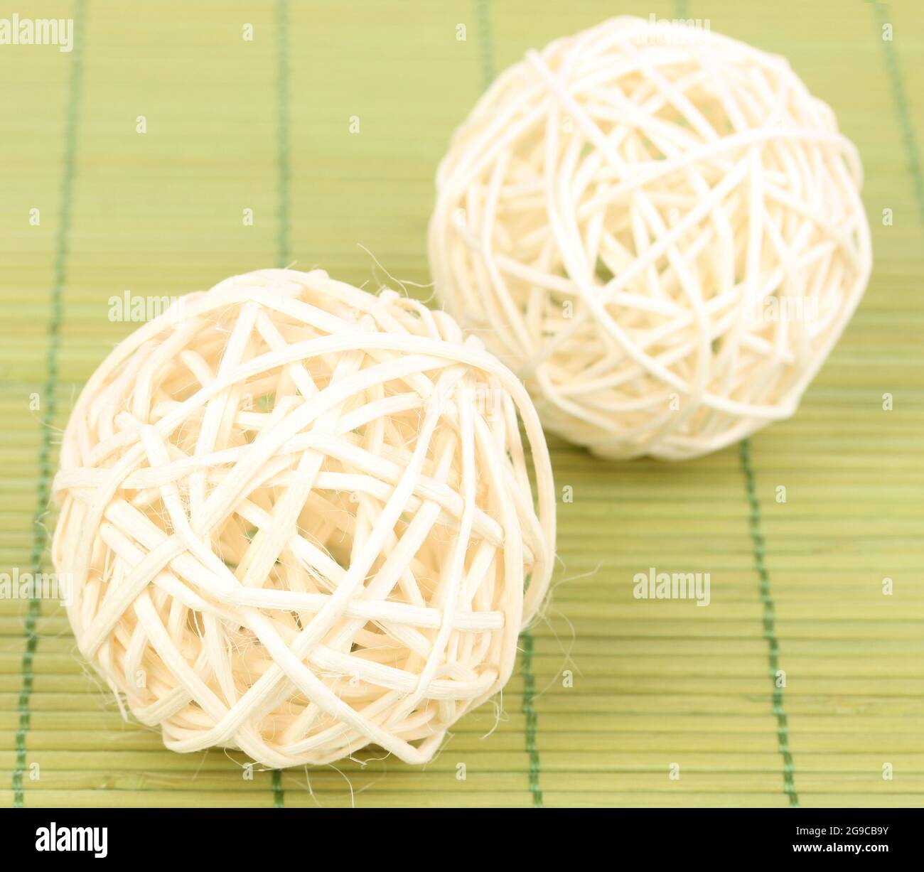 wicker bamboo balls on bamboo mat Stock Photo - Alamy