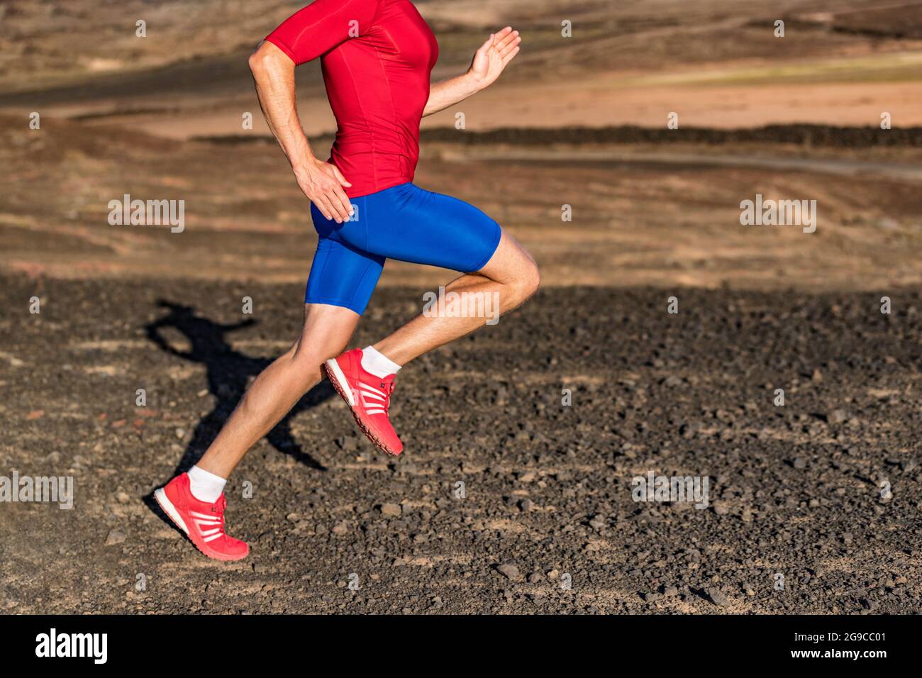 Man runner athlete running on trail run path in mountains. Legs and ...