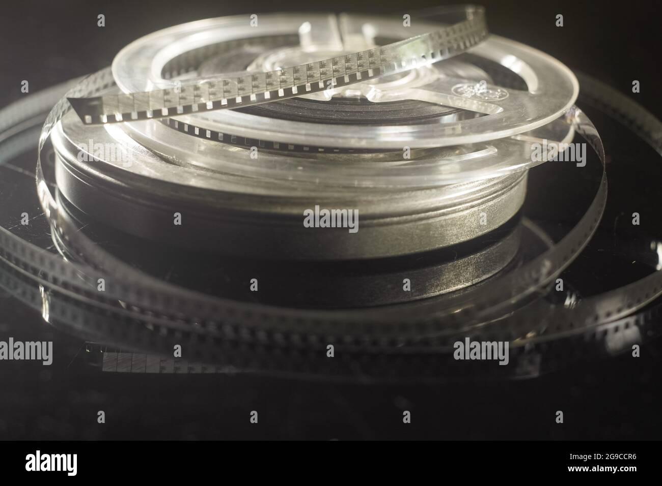 Old spools with black and white film stock. Retro style Stock Photo - Alamy