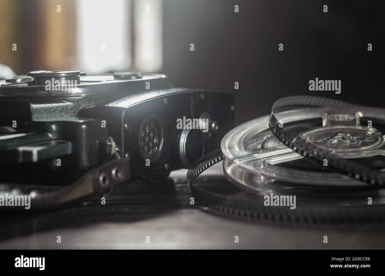 Old amateur movie camera and reels of film stock. Retro style Stock ...
