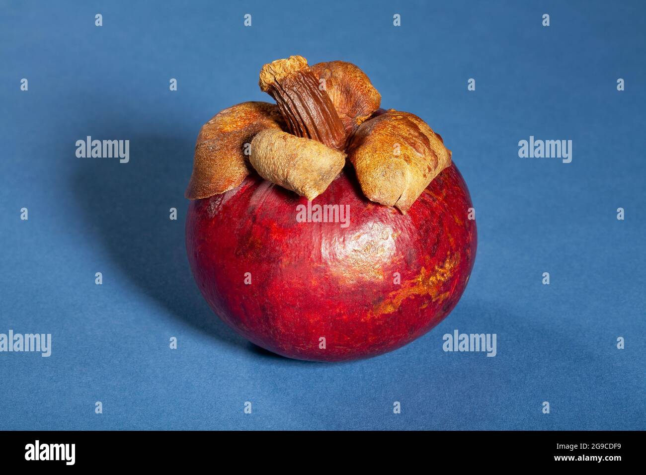 Single mangosteen on red hi-res stock photography and images - Alamy