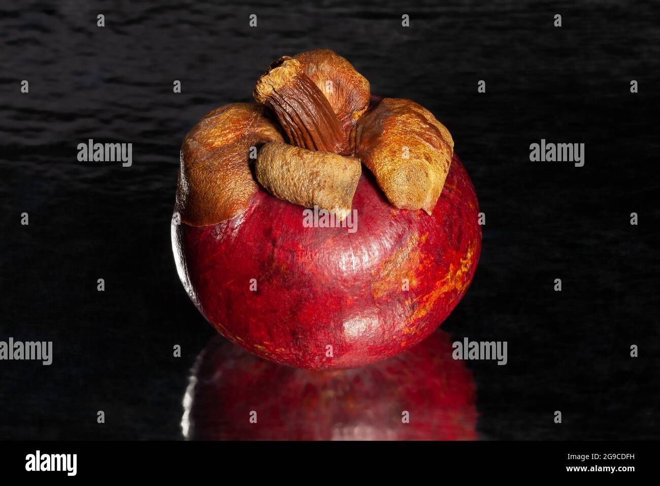 Single mangosteen on red hi-res stock photography and images - Alamy