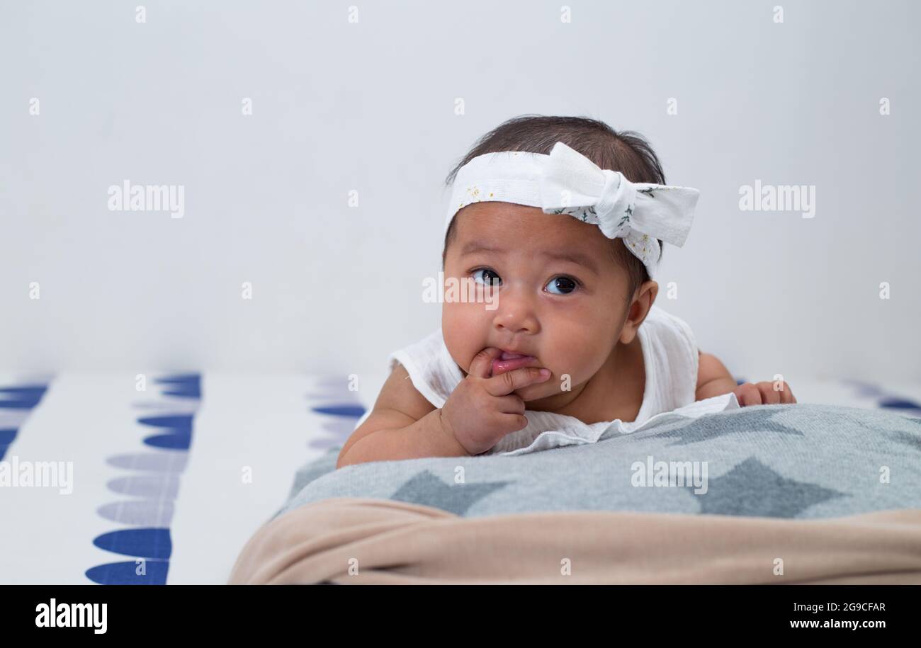 A closeup of a southeast asian cute surprised baby Stock Photo - Alamy