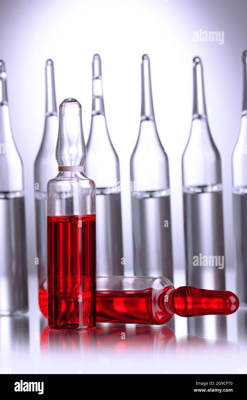 medical ampules on grey background Stock Photo - Alamy