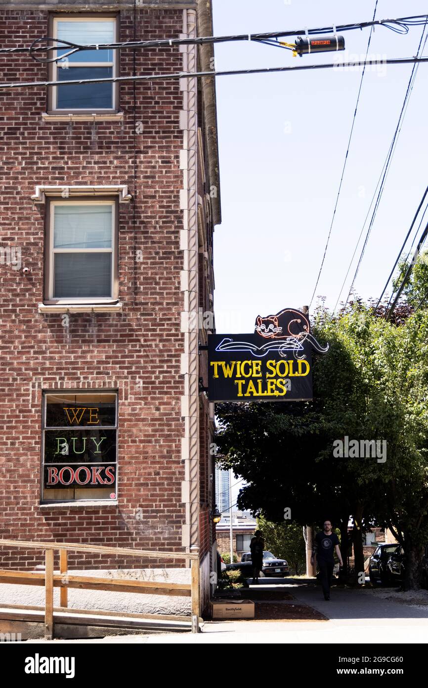 Signs outside Twice Sold Tales, a used bookstore on Harvard Avenue in ...