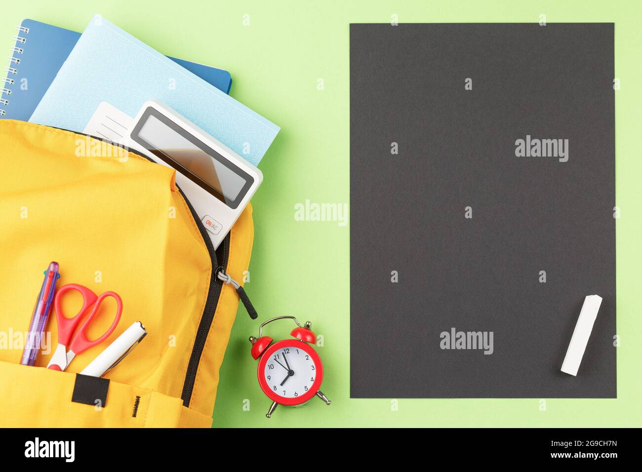 School board with backpack and study supplies Stock Photo - Alamy