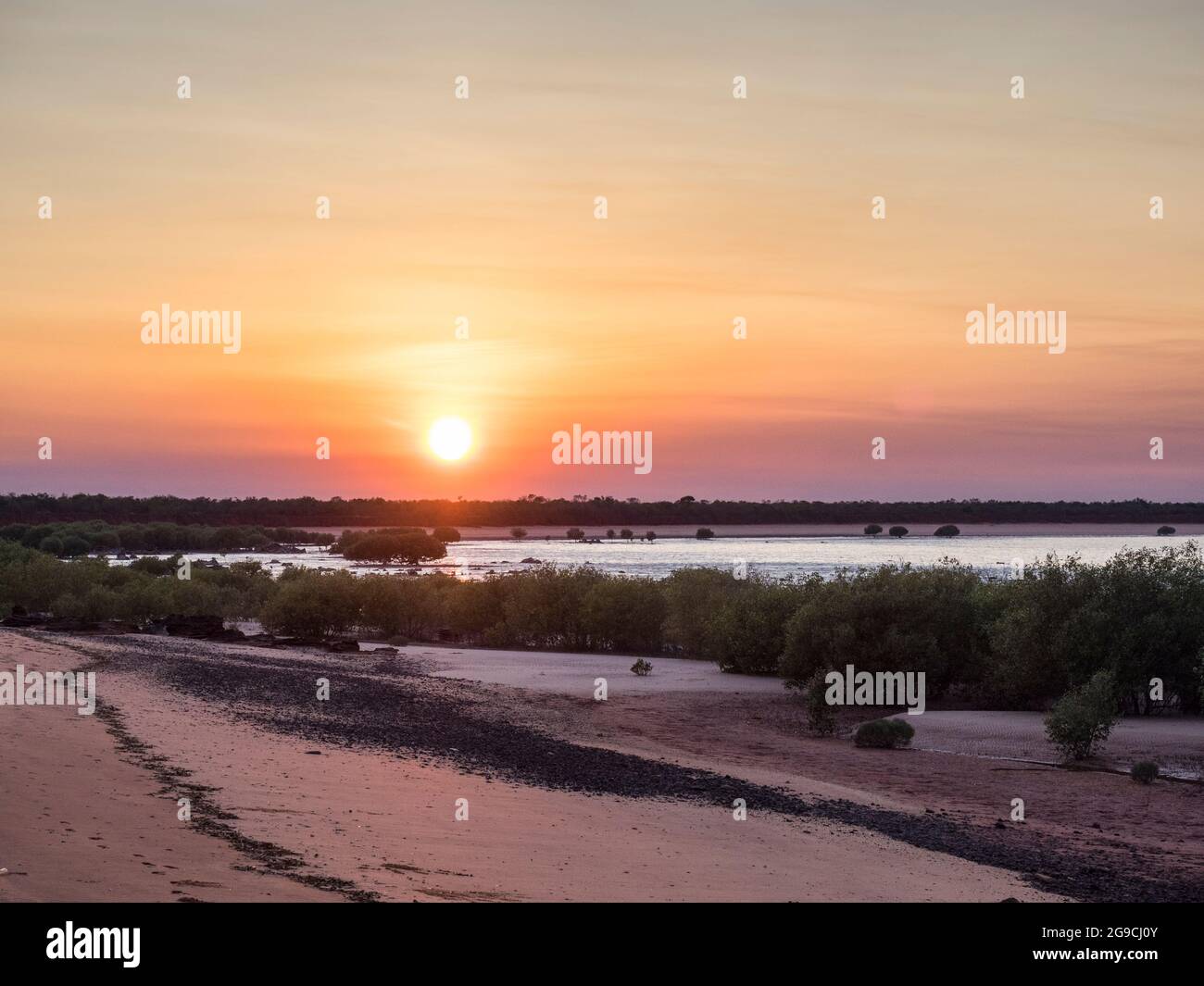 Sunrise over sand and mangroves on Roebuck Bay near Broome, Kimberley ...