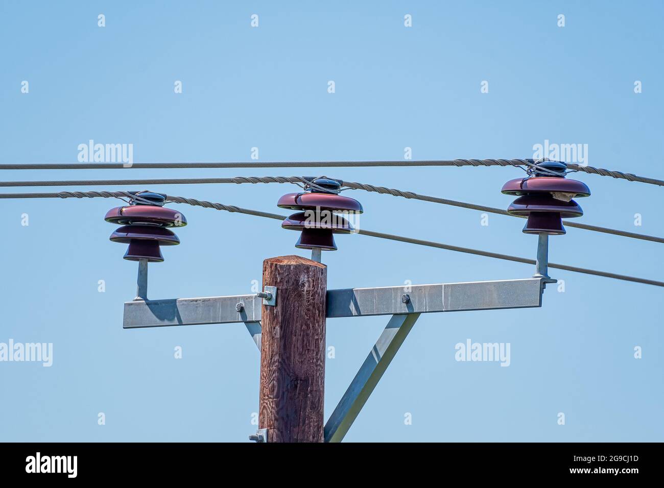 Close view of power cables on a pole with the ceramic isolators Stock ...